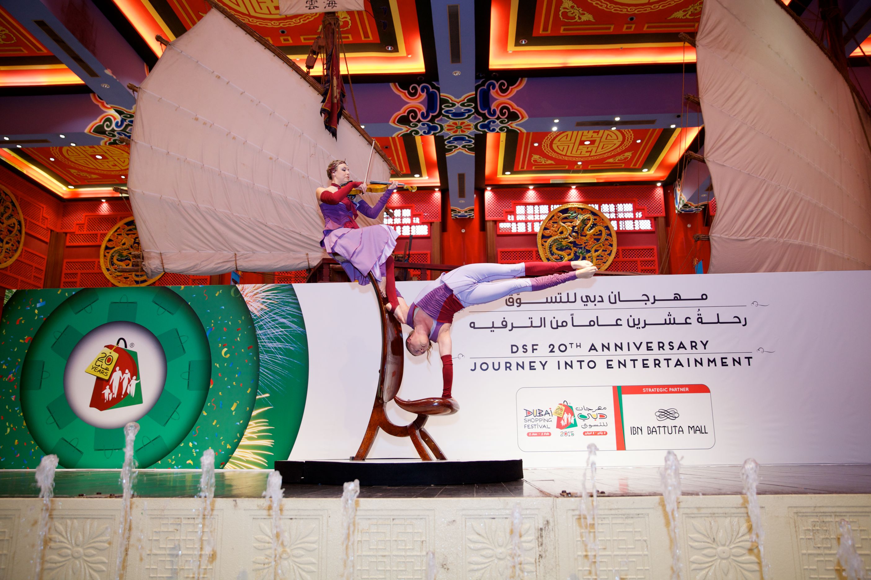 Acro Violin performers flex their muscles to music